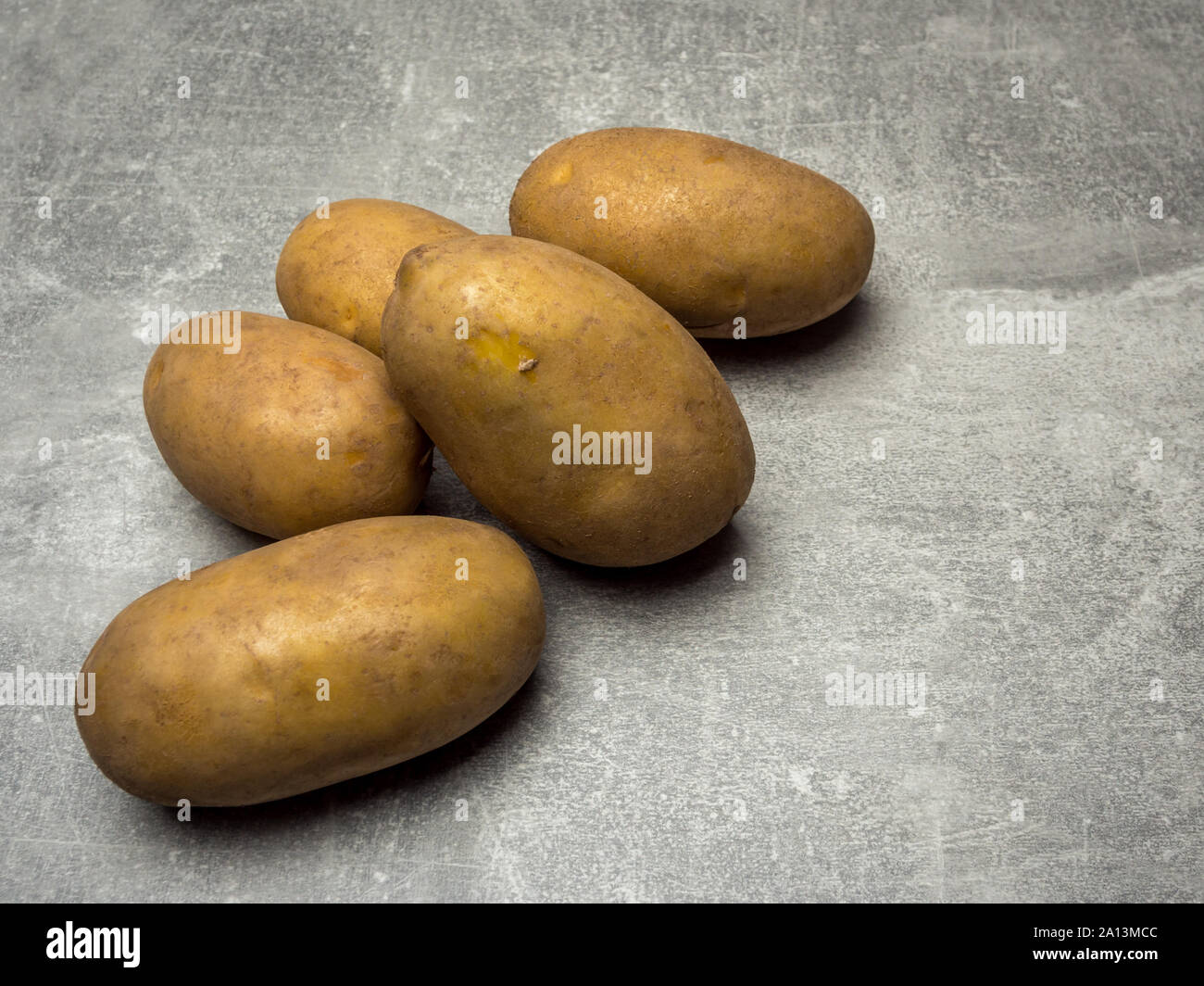 Pile uncooked potatoes shallow focus hi-res stock photography and ...