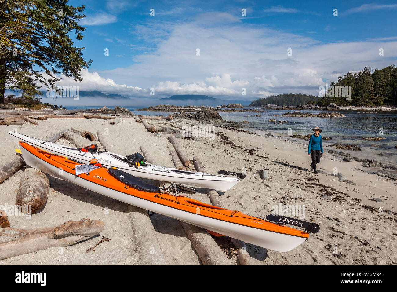A kayaker strolls along the beach on Clarke island in the The Broken ...