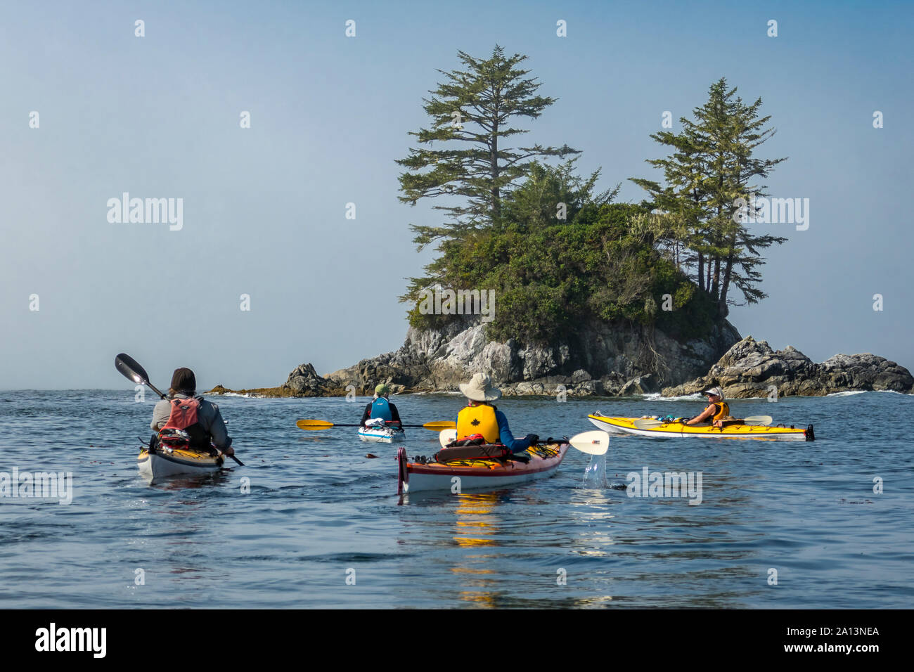 Kayakers paddle among the The Broken Group Islands in Pacific Rim ...