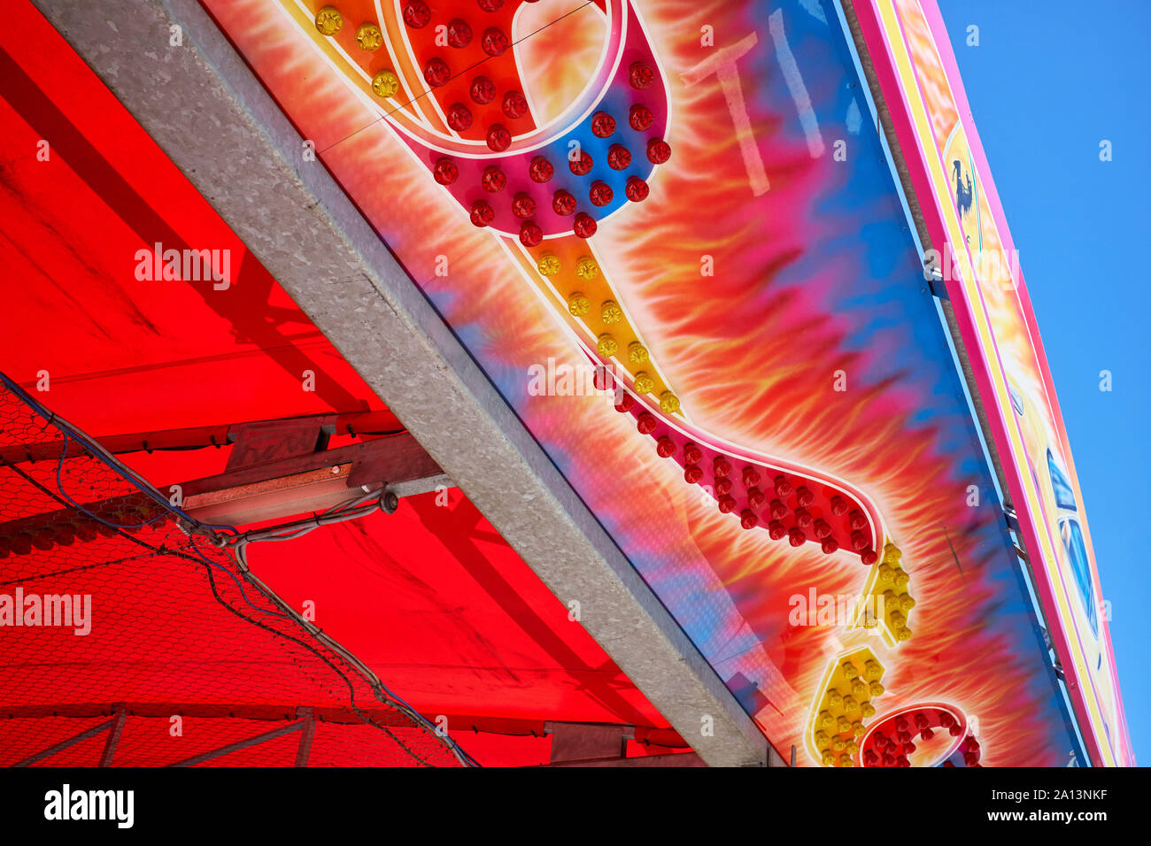Vivid, colourful section of a fairground ride Stock Photo - Alamy