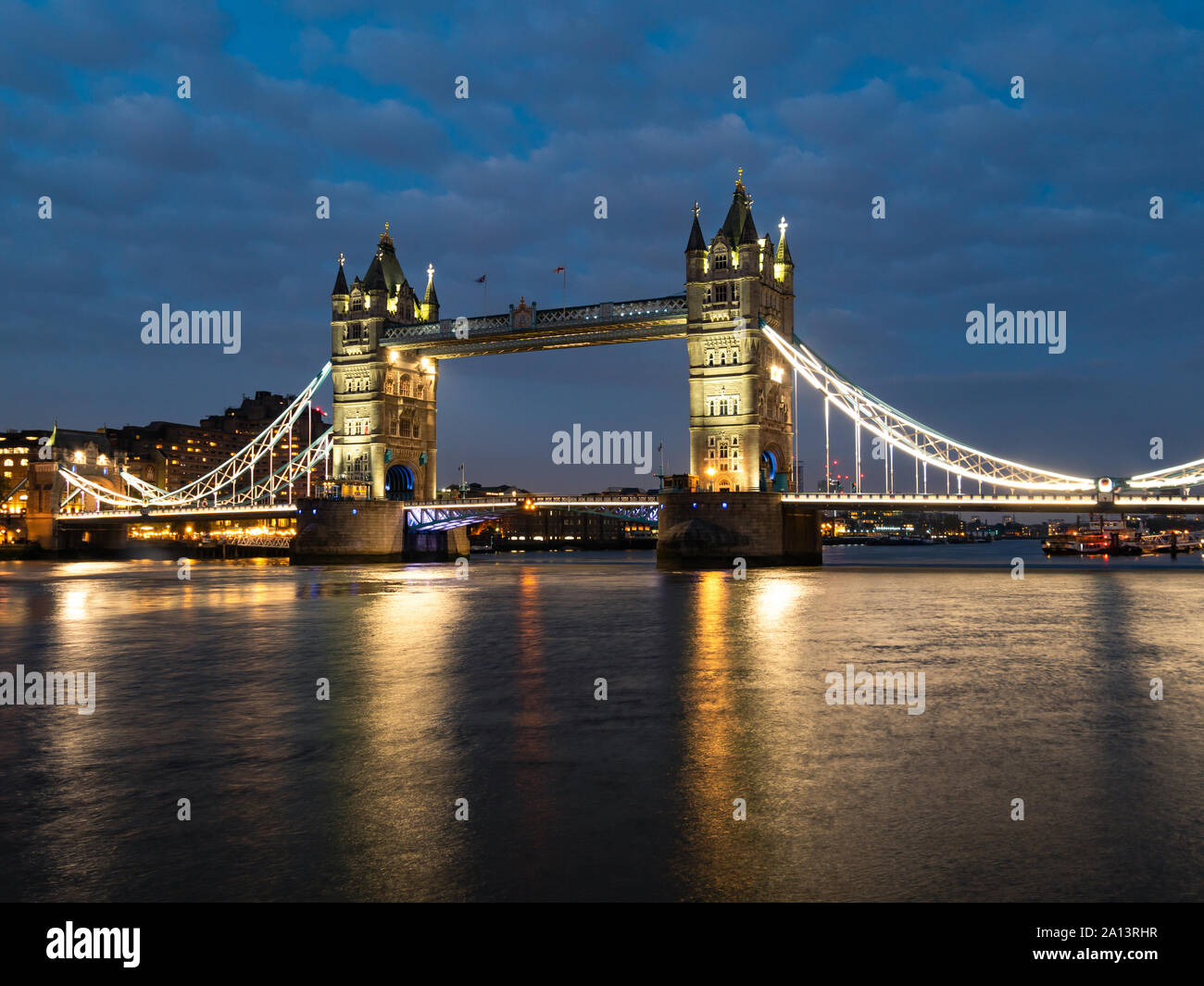 Tower Bridge at night illuminated by floodlights. Famous Tower Bridge ...
