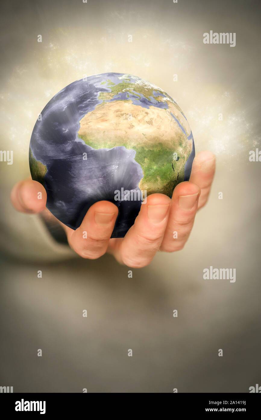 Human hand holding the planet earth hi-res stock photography and images ...