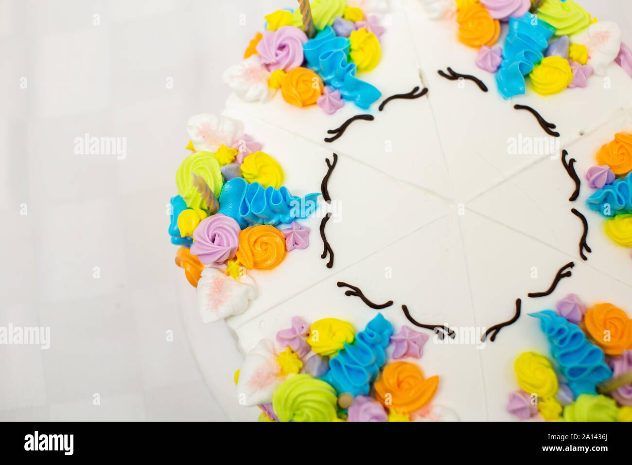 Overhead photography of unicorn cake in white background Stock Photo ...
