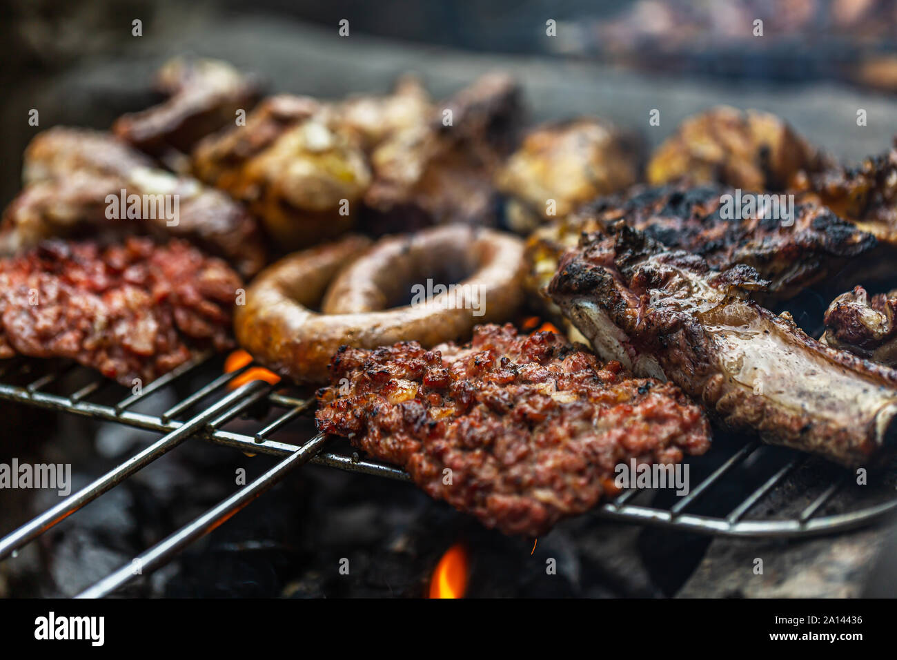 Barbeque grill mixed meat cooking on open air Stock Photo - Alamy
