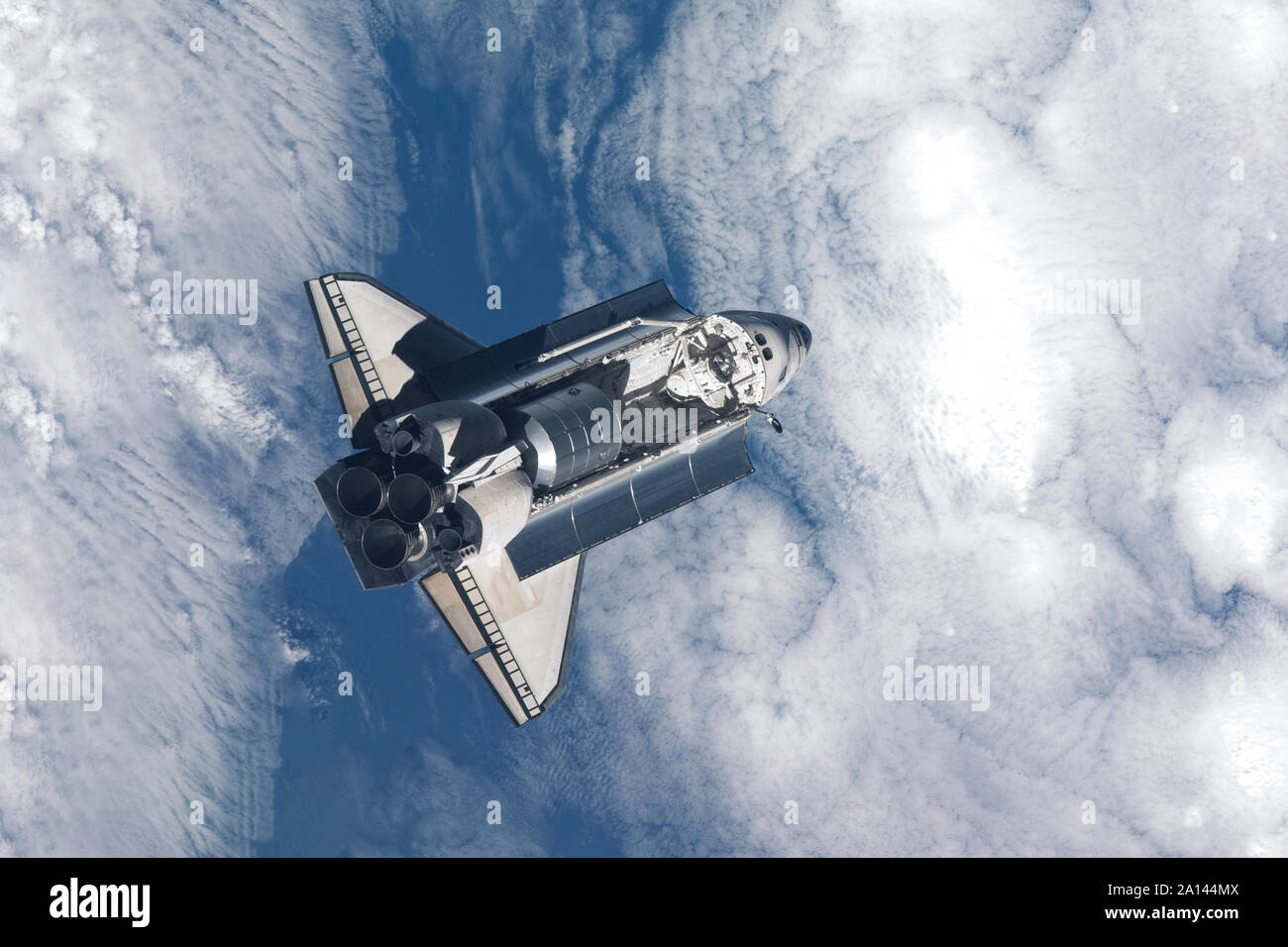 Space shuttle flies in the upper atmosphere. Elements of this image ...