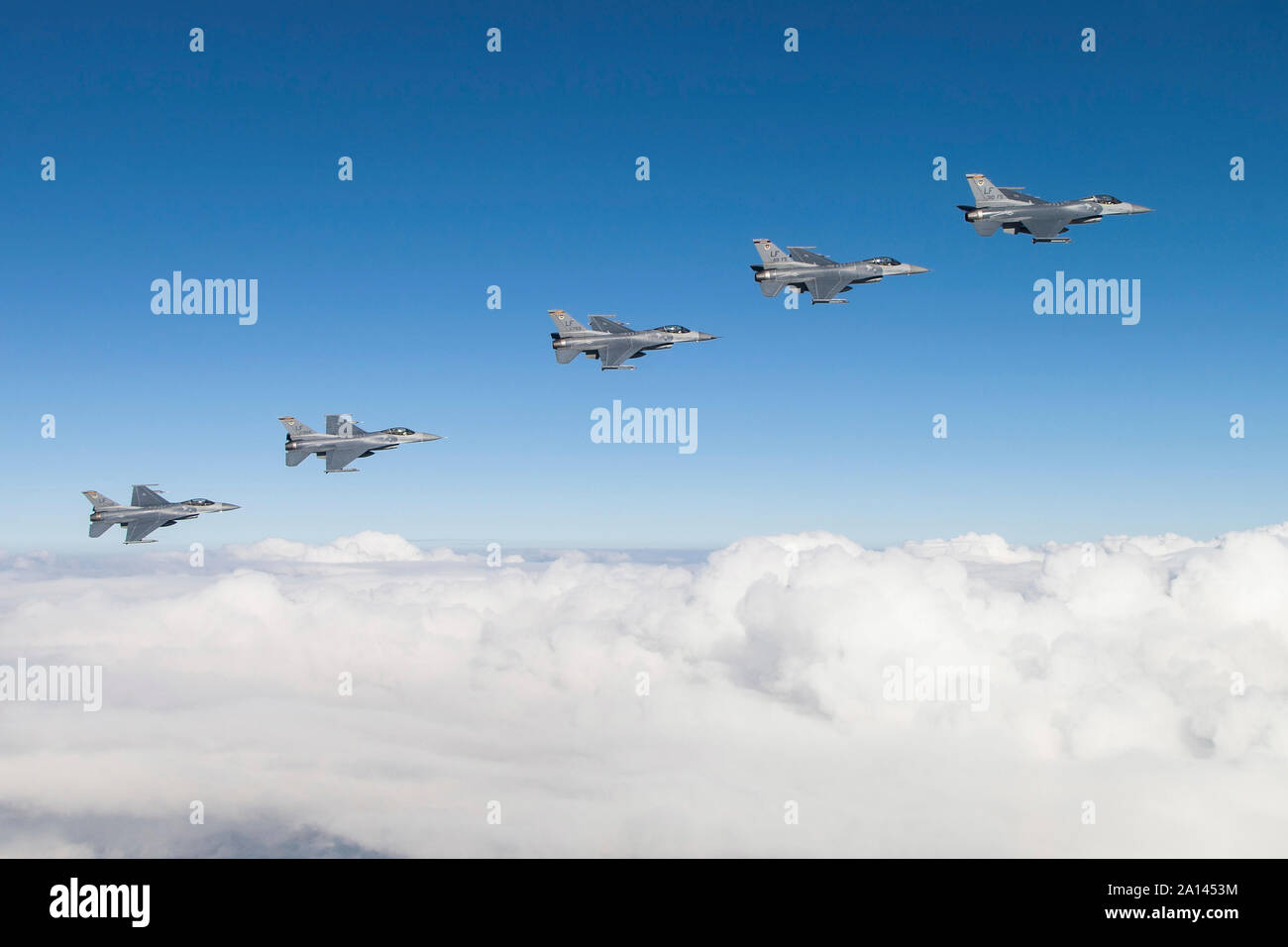 Five F-16Cs of the U.S. Air Force 310th Fighter Squadron fly in ...