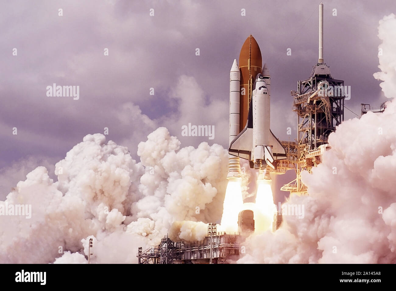 The launch of the space shuttle. With fire and smoke. Against the ...