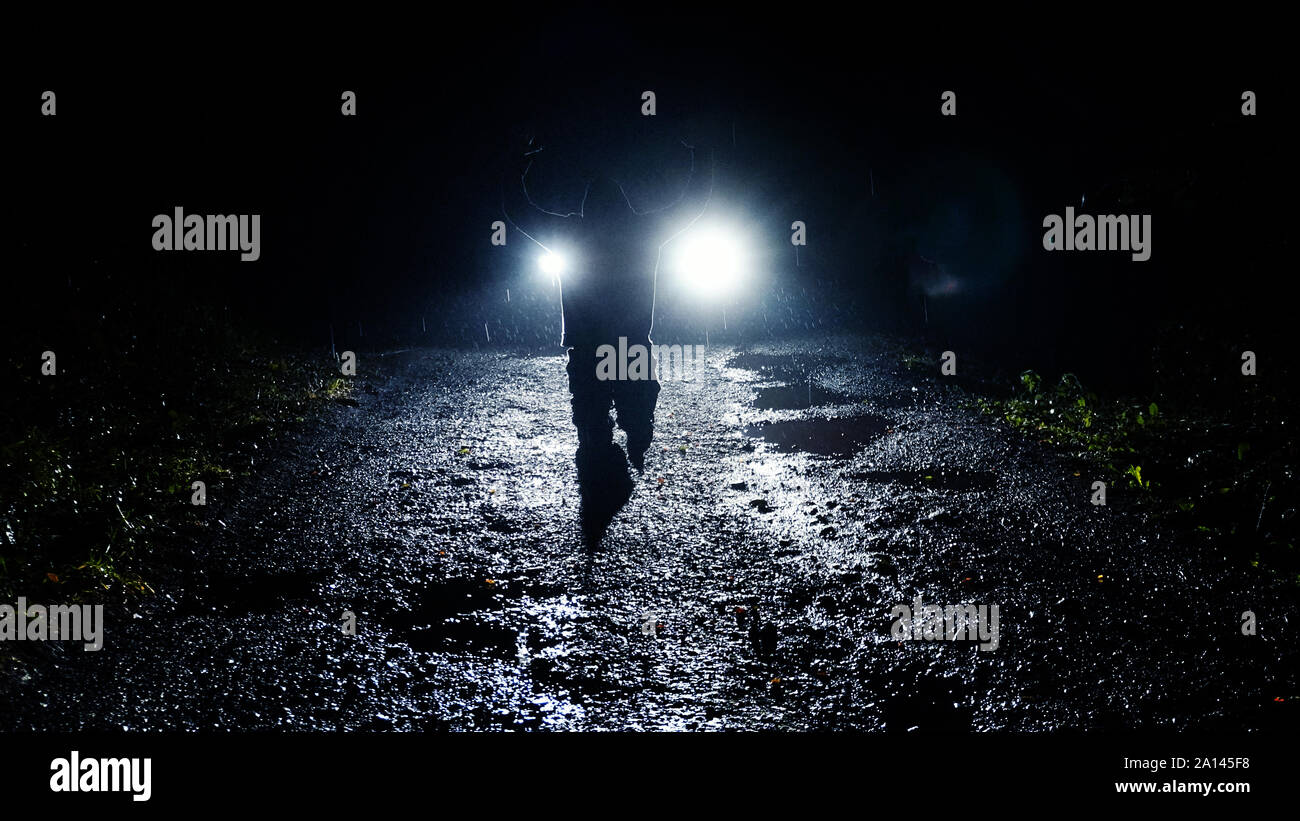 Man standing in front headlights hi-res stock photography and images ...