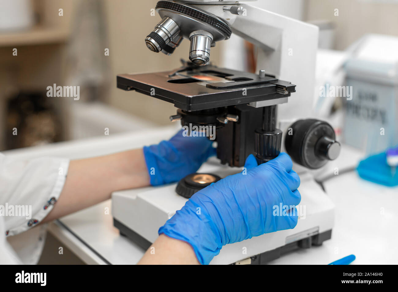 Closeup lab technician research blood sample in microscope Stock Photo ...
