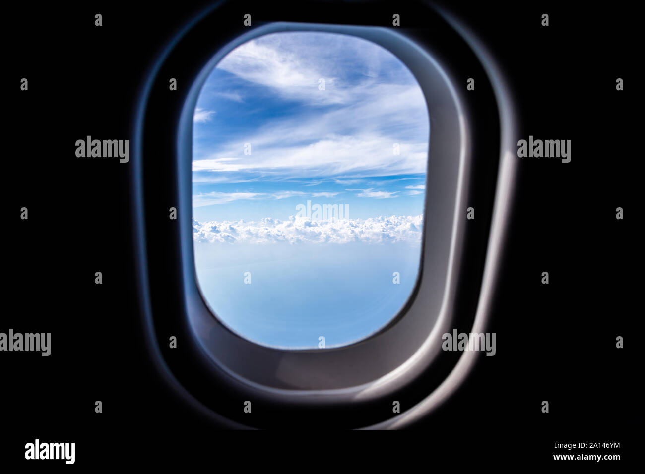 View from a jet plane window high on blue sky Stock Photo - Alamy