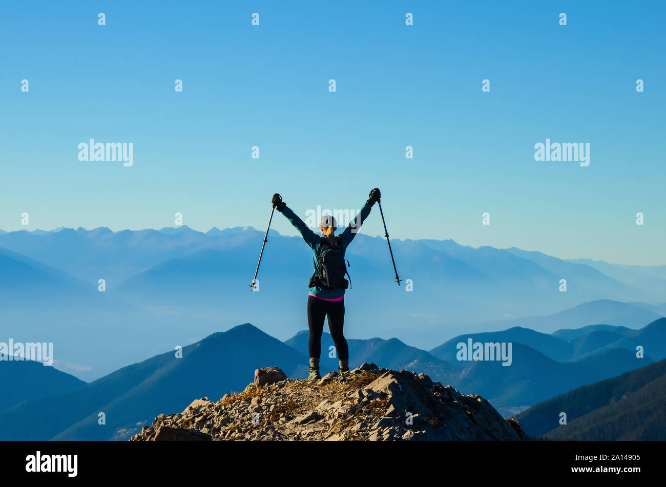 Female mountain hiker reaching peak hi-res stock photography and images ...