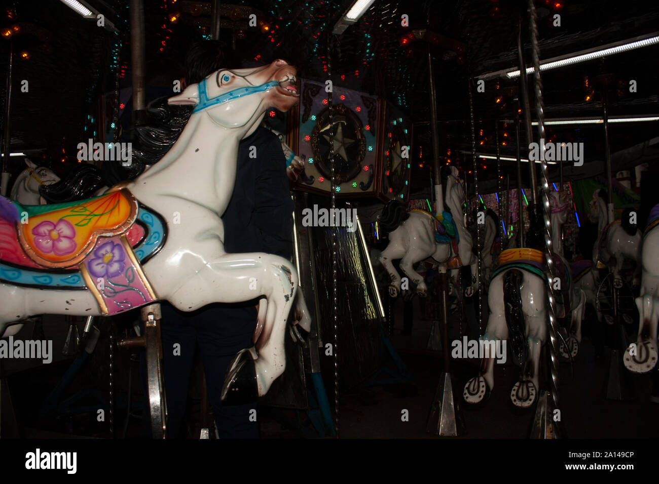 Horse carousel with coloured spotlights in Mexico Stock Photo - Alamy