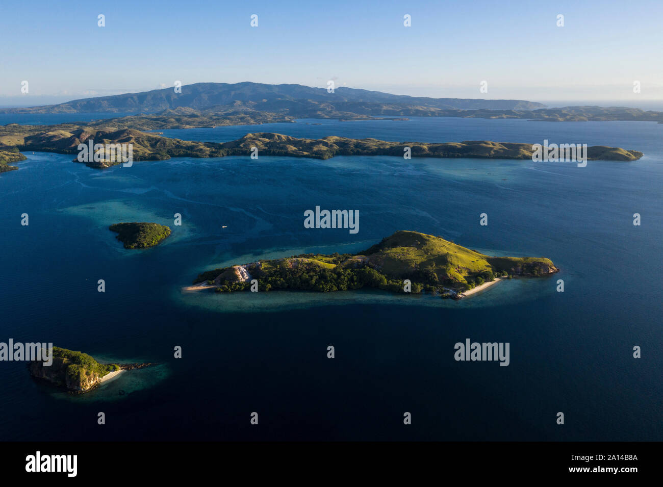 Bird's eye view shows scattered islands and fringing reefs in Komodo ...
