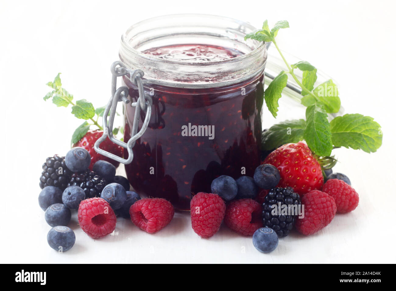 A Jar Of Jam With Mixed Berries Isolated On White Stock Photo - Alamy