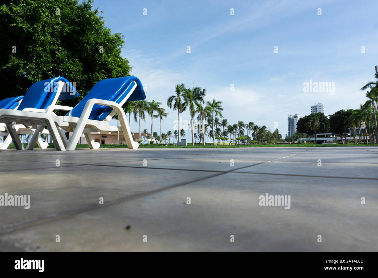 A relaxing summer vacation with sun bath bed near a swimming of a ...