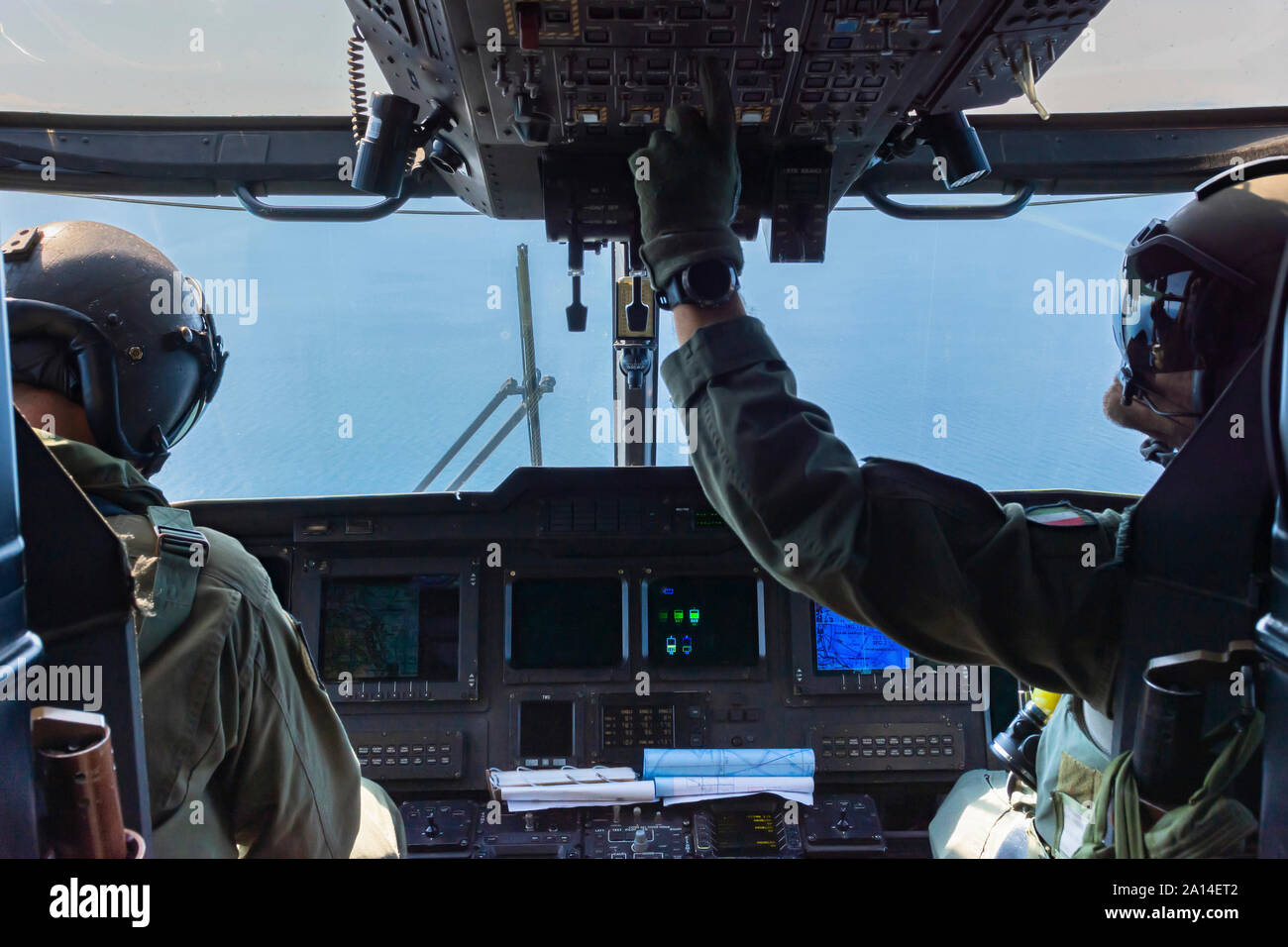 Pilots inside the cockpit of an Italian Navy AW101 assault helicopter ...