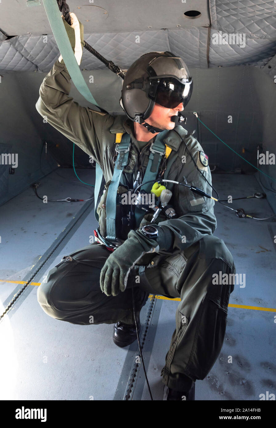 Italian Navy crewman-operator onboard a AW101 Merlin helicopter Stock ...