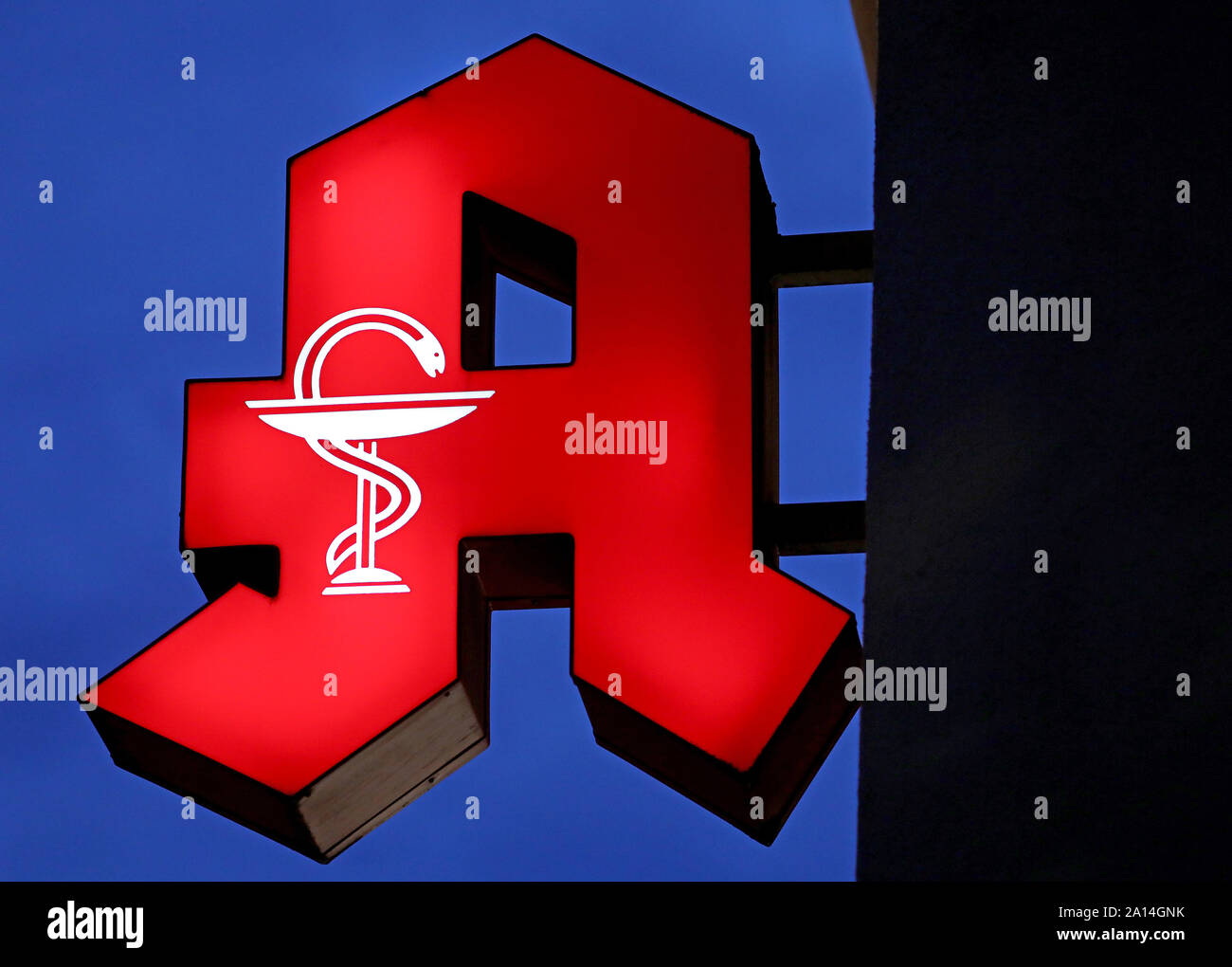 Cologne, Germany. 23rd Sep, 2019. The pharmacy logo lights up at a ...