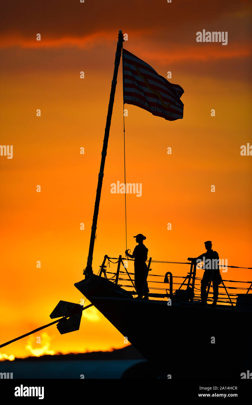 Sailors stand-by for evening colors on USS Hopper Stock Photo - Alamy