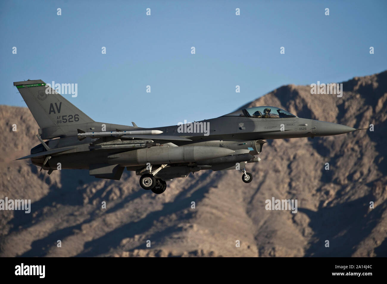 An F-16 Fighting Falcon approaches the runway for landing Stock Photo ...