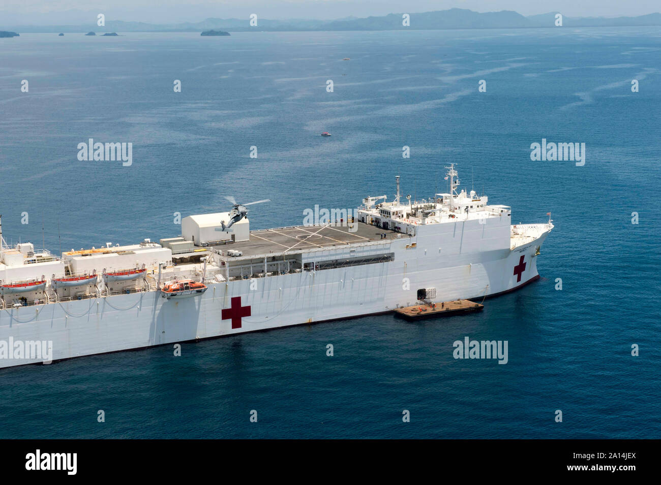 An MH-60S Seahawk helicopter lands on the hospital ship USNS Mercy ...