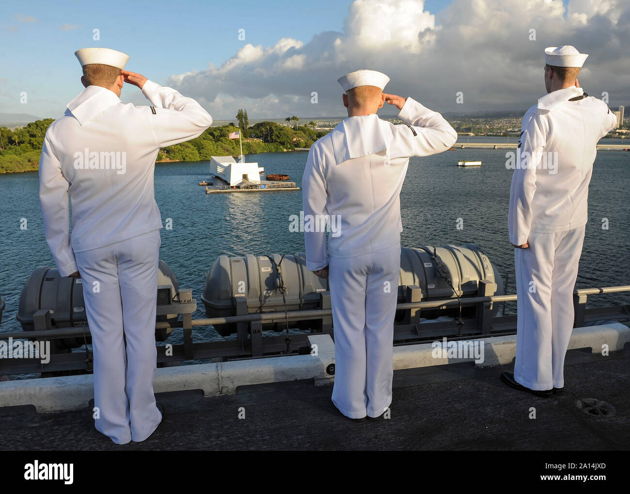 U.S. Navy Sailors render honors to the USS Arizona memorial Stock Photo ...