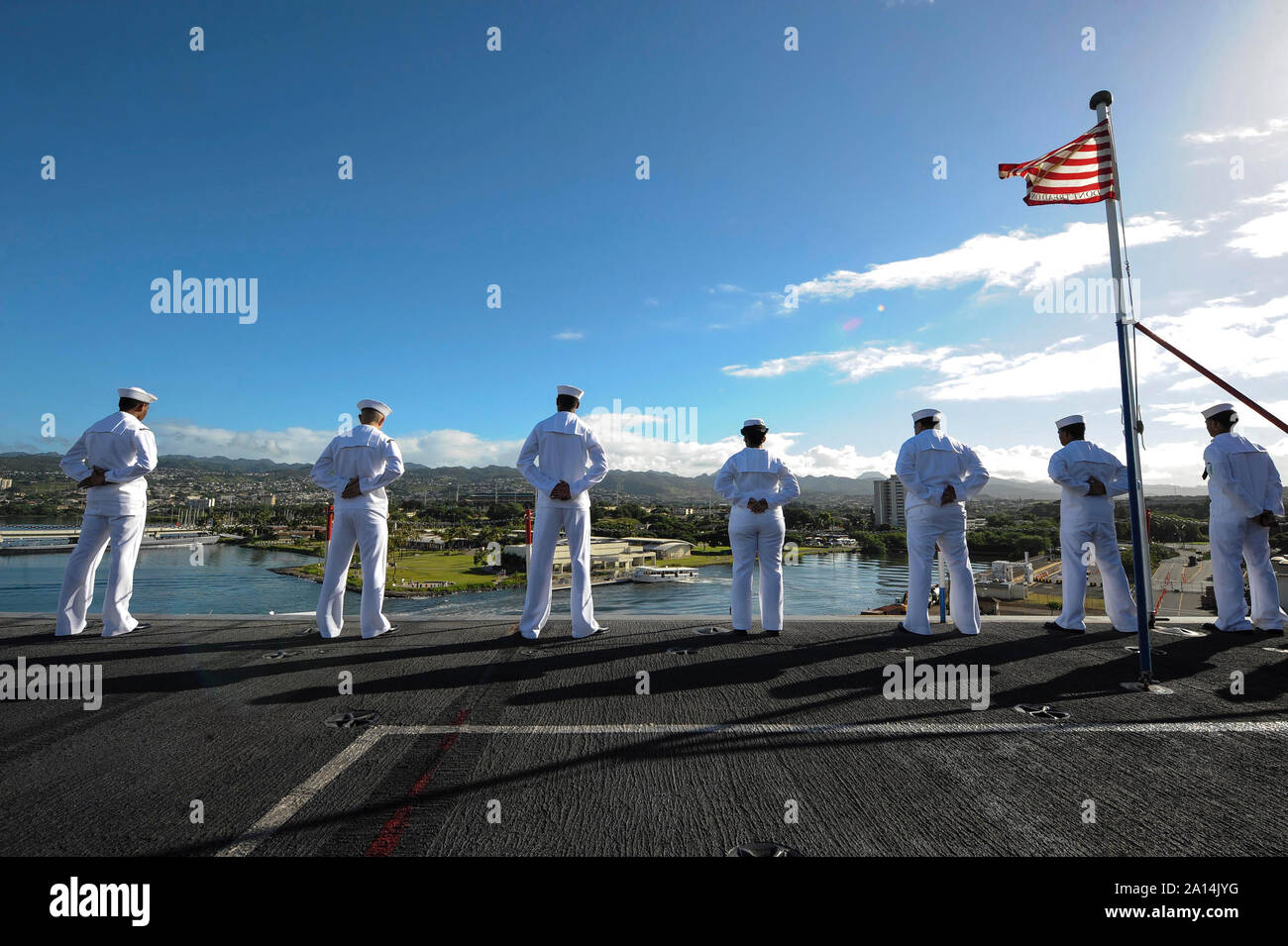 U.S. Sailors and Marines man the rails aboard USS Theodore Roosevelt ...