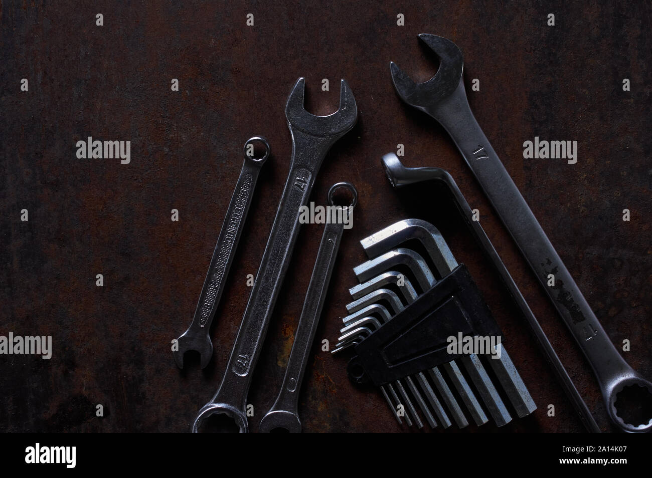 Metallic tools on the rusty metal floor Stock Photo - Alamy