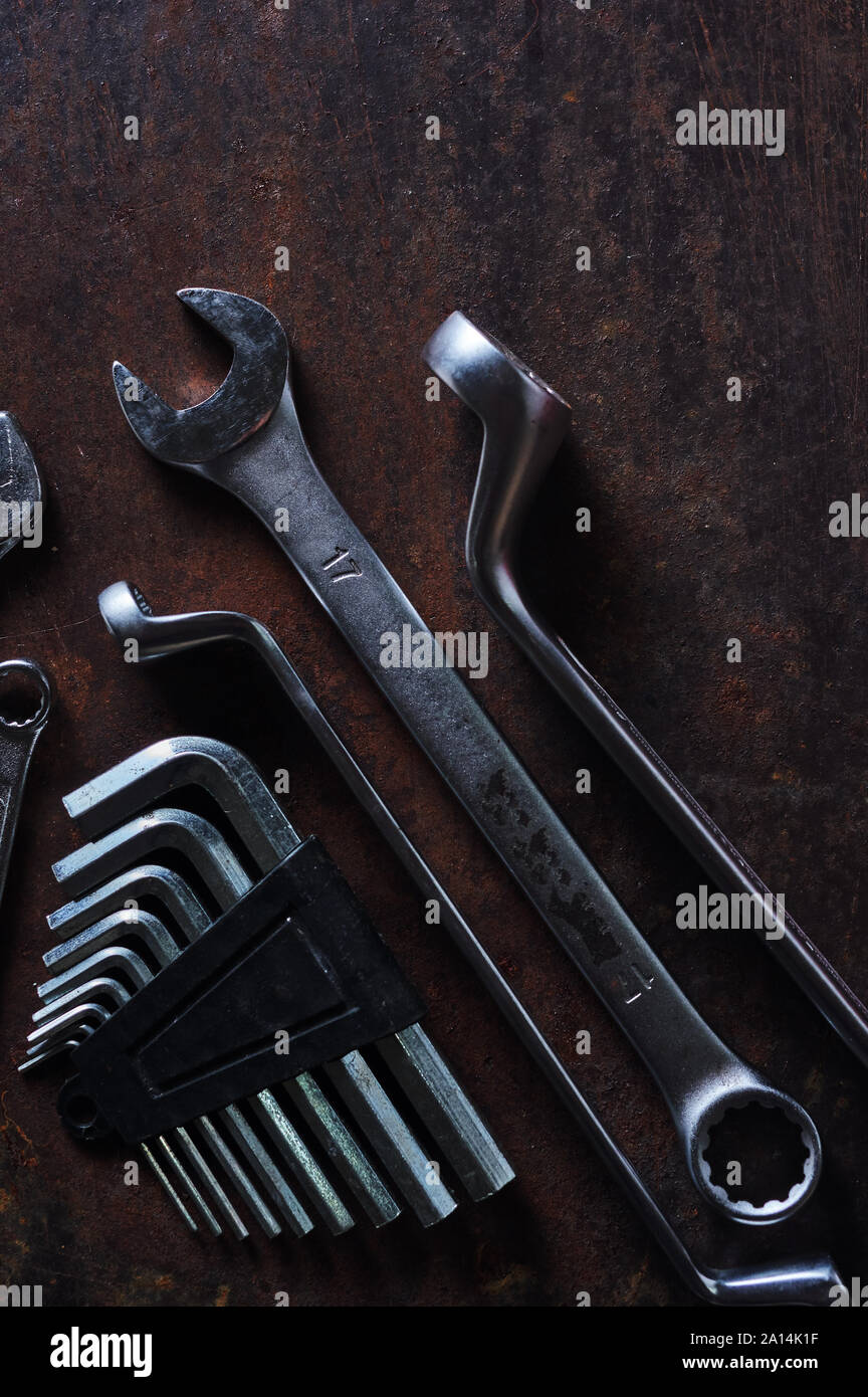 Metallic tools on the rusty metal floor Stock Photo - Alamy