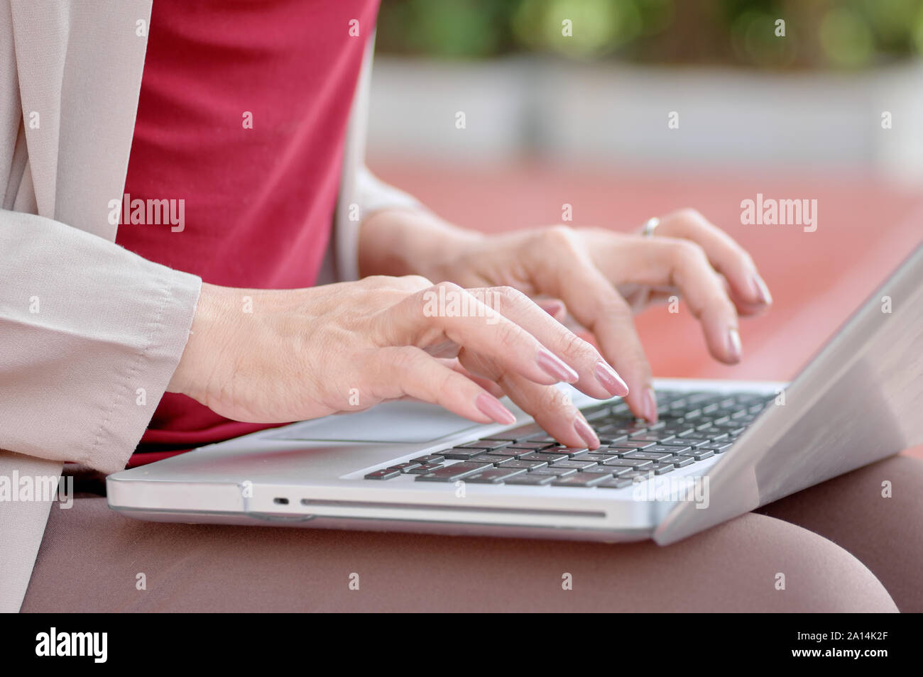 Woman typing on keyboard of computer laptop Stock Photo - Alamy