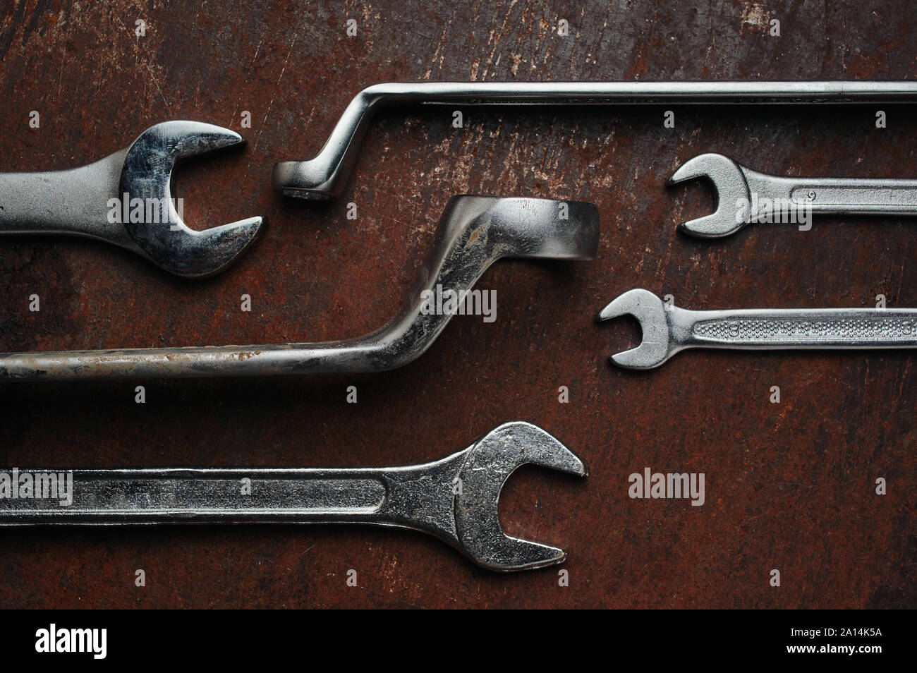 Metallic tools on the rusty metal floor Stock Photo - Alamy