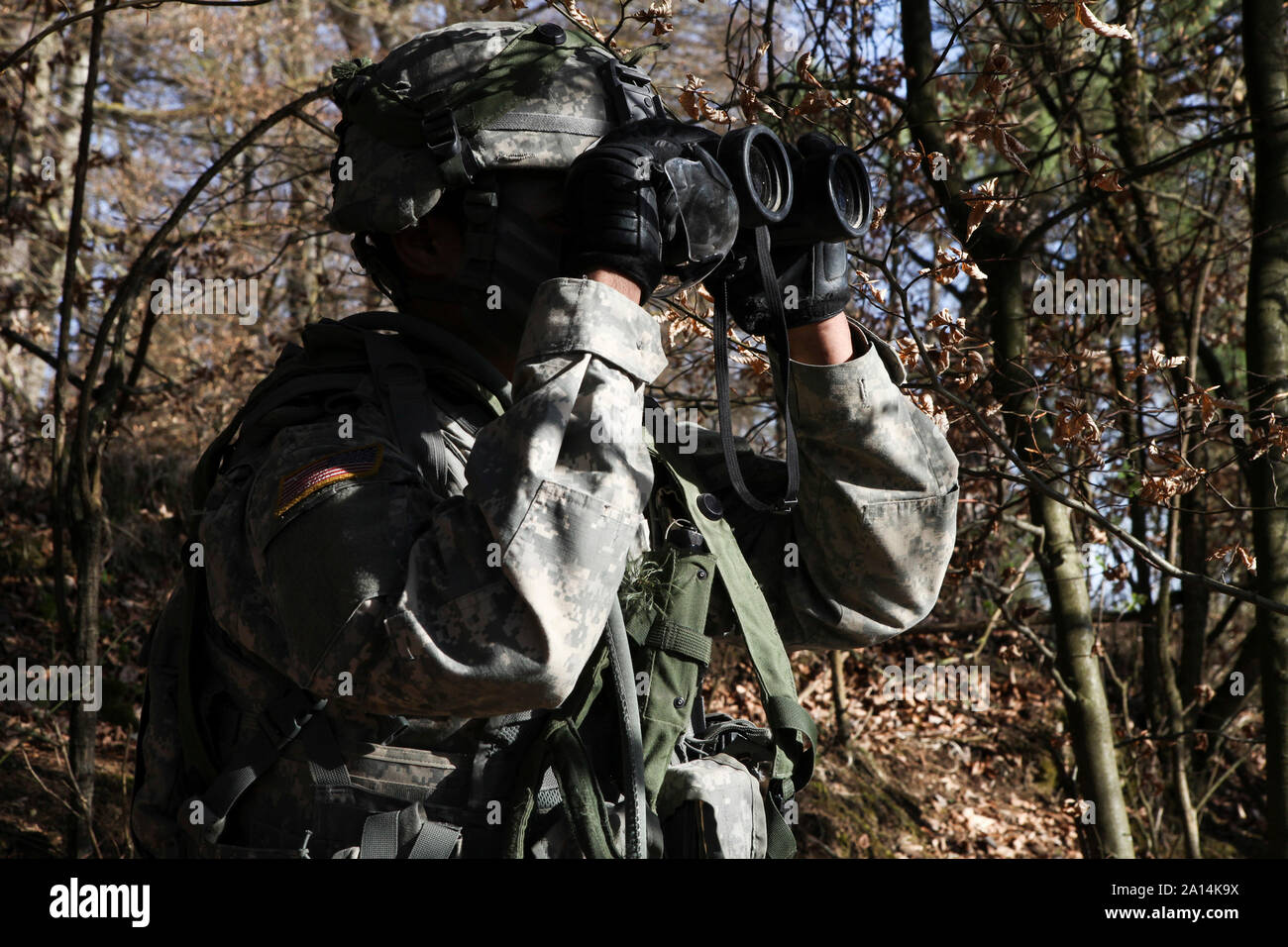 A U.S. Army Soldier scans the area while conducting zone reconnaissance ...
