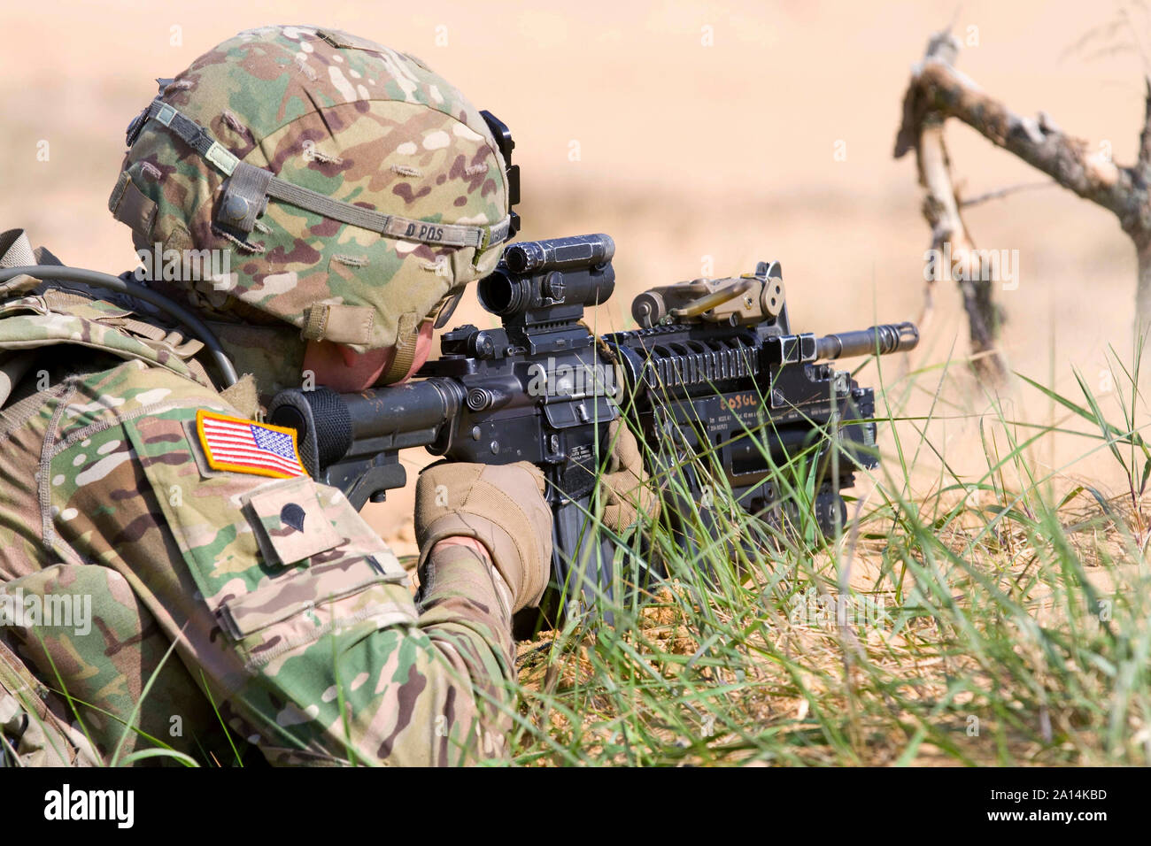 U.S. Army Soldier fires at targets during a joint live-fire exercise ...