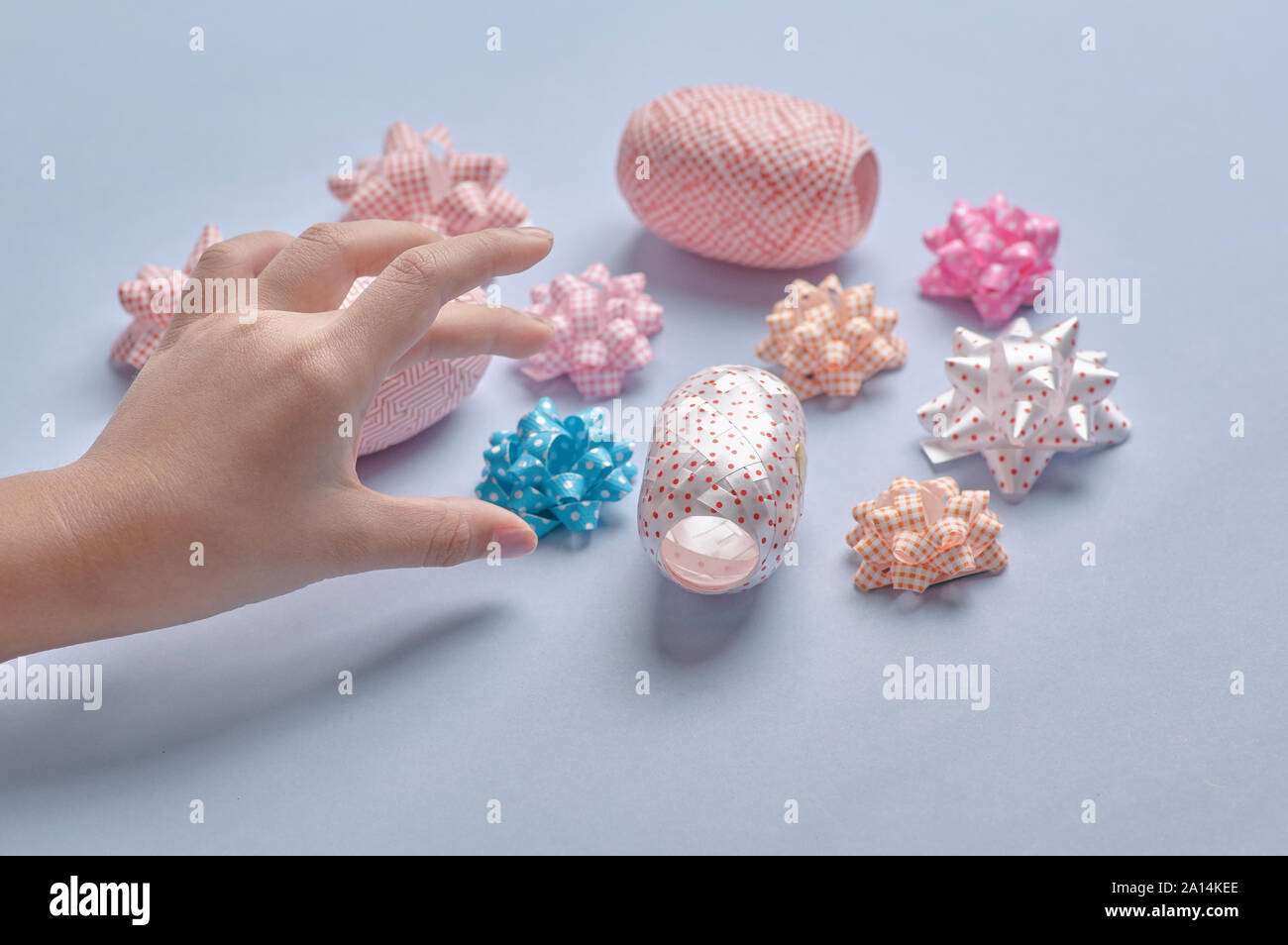 Hand with ribbon hi-res stock photography and images - Alamy