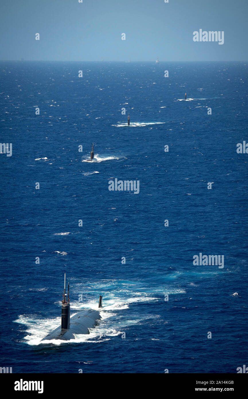 Los Angeles-class fast-attack submarine USS Cheyenne leads a convoy of ...