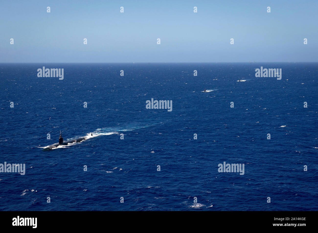 Los Angeles-class fast-attack submarine USS Cheyenne leads a convoy of ...
