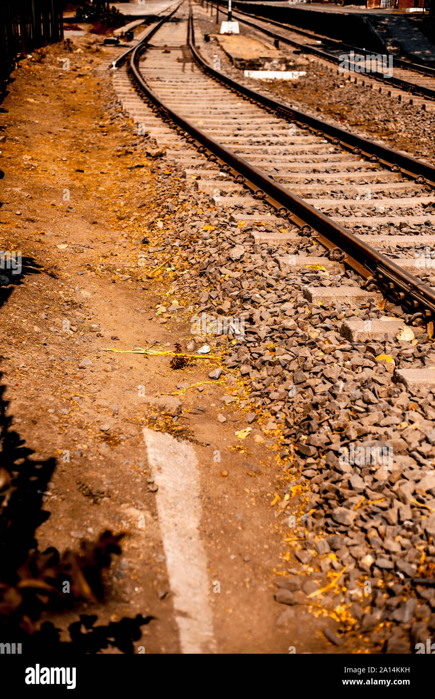 Empty railway track and freight train passing hi-res stock photography ...