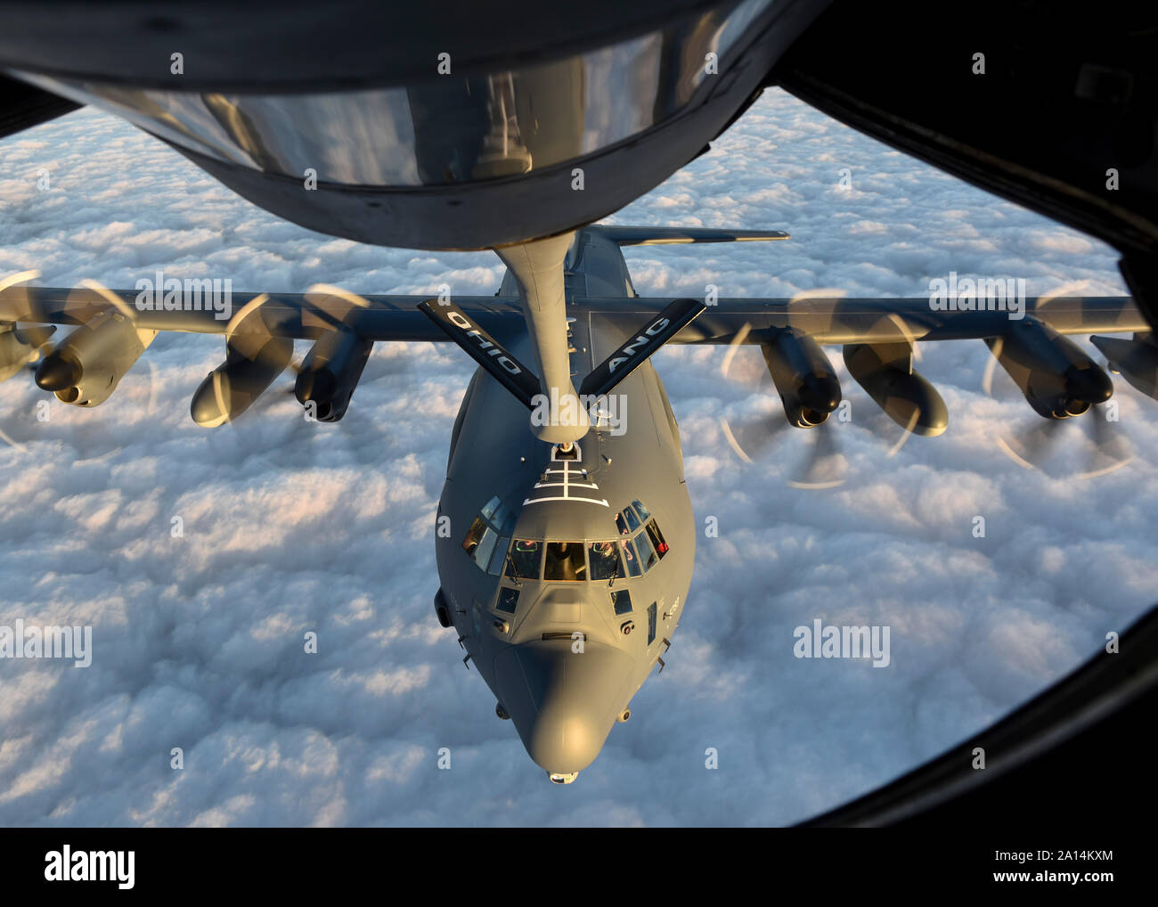 An MC-130J Commando II receives fuel from a KC-135R Stratotanker Stock ...