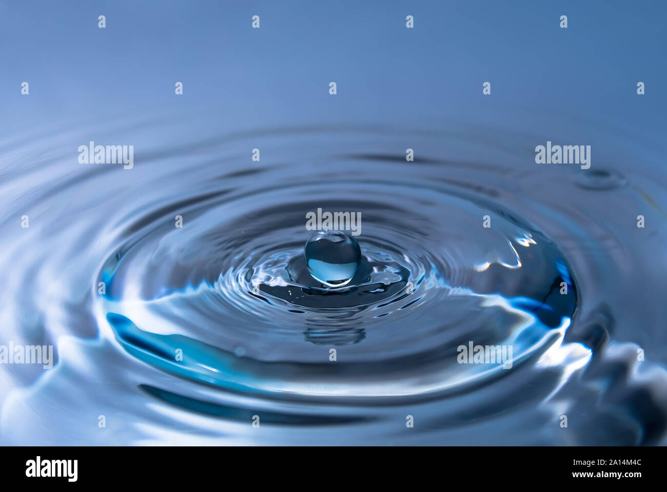 Water splash or drop. Water splash close-up. Blue water drop. Falling ...