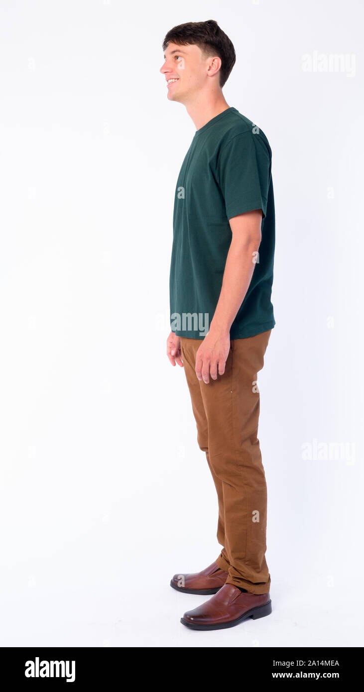 Full body shot profile view of happy young handsome man smiling Stock ...