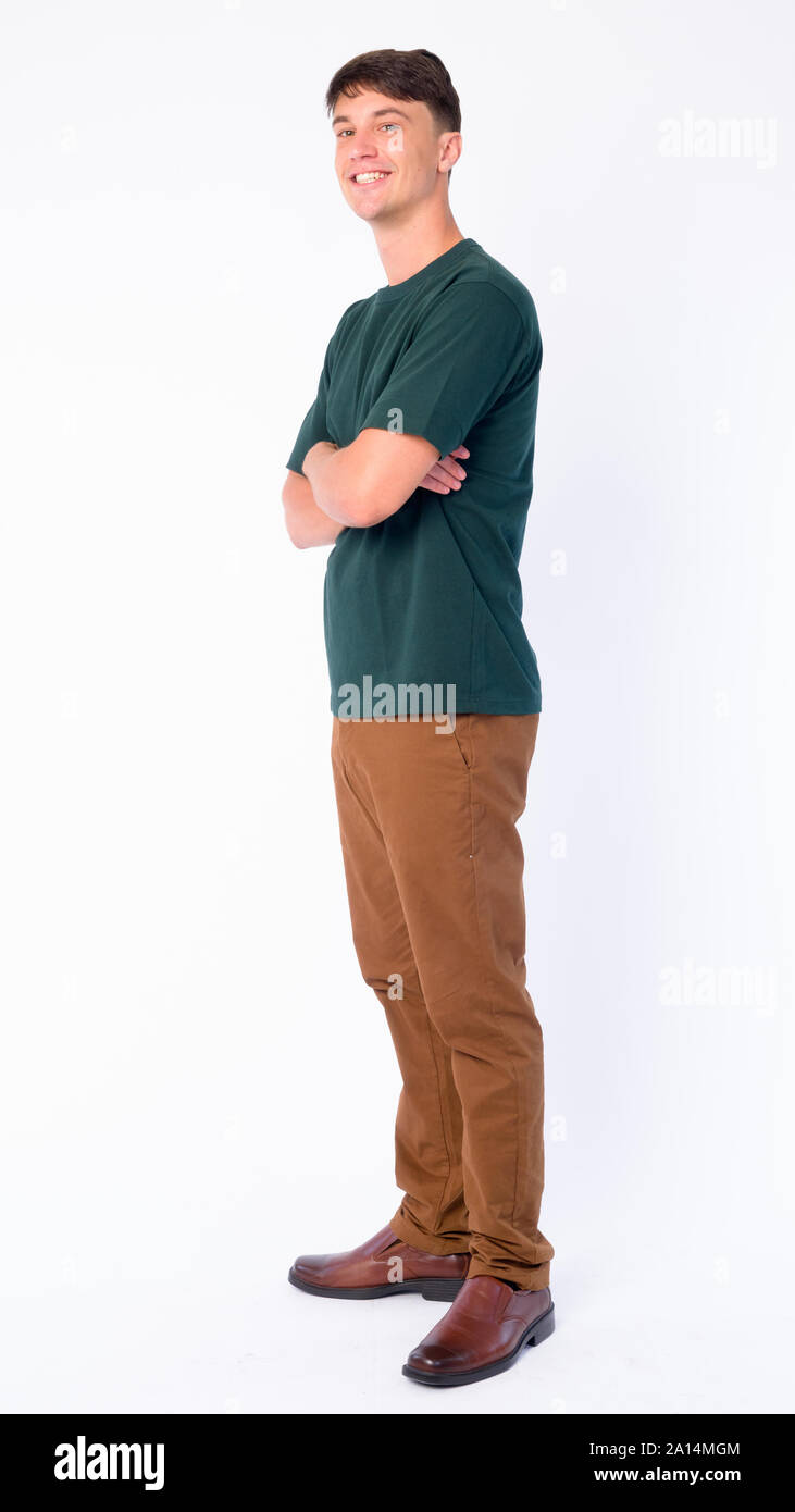 Full body shot profile view of happy young handsome man looking at ...