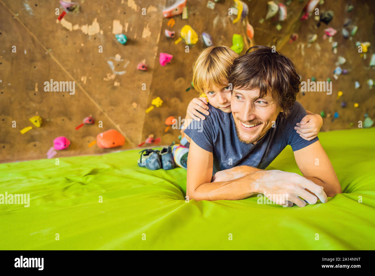 Dad and son at the climbing wall. Family sport, healthy lifestyle ...