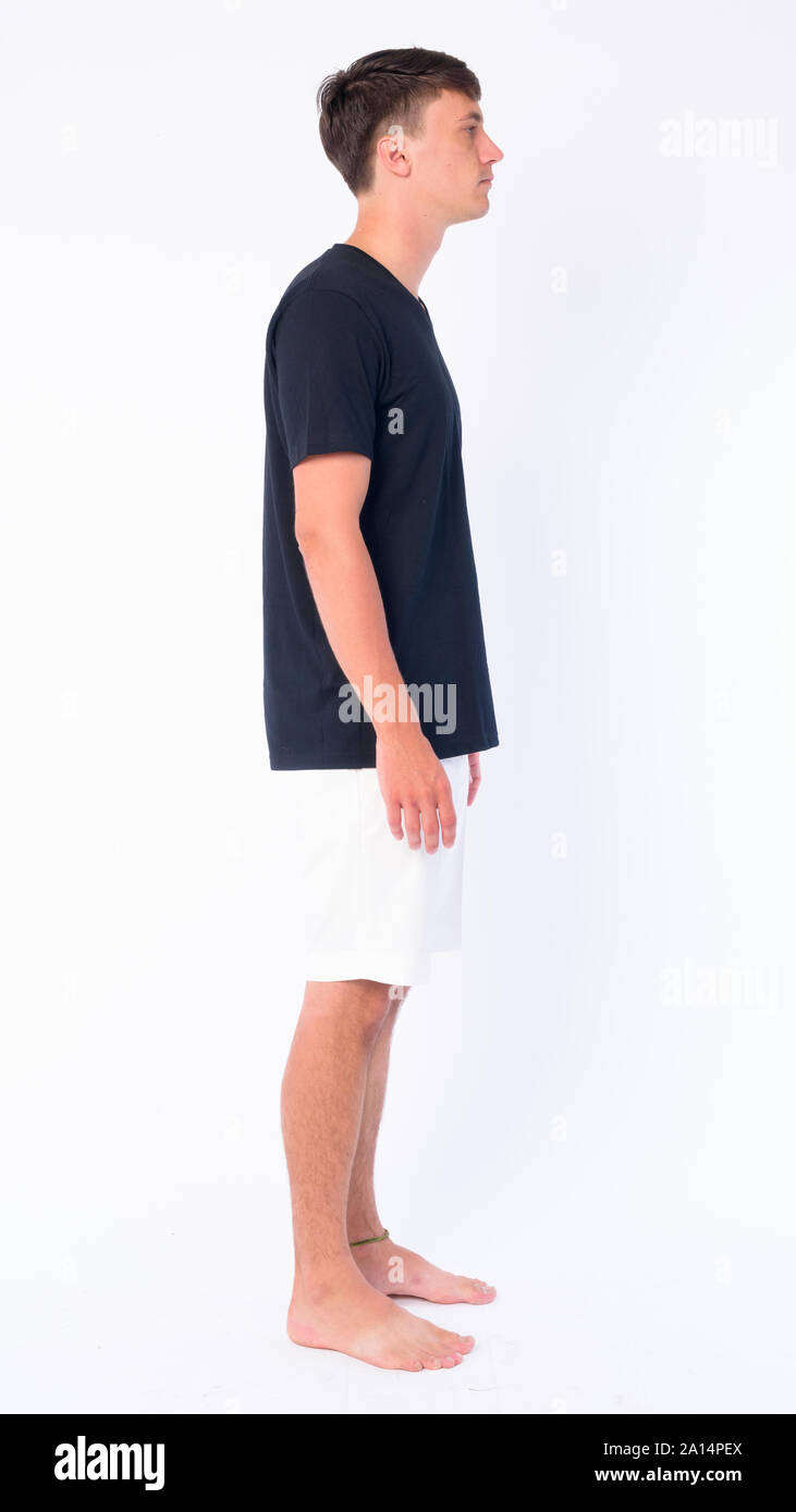 Full body shot profile view of young handsome man Stock Photo - Alamy