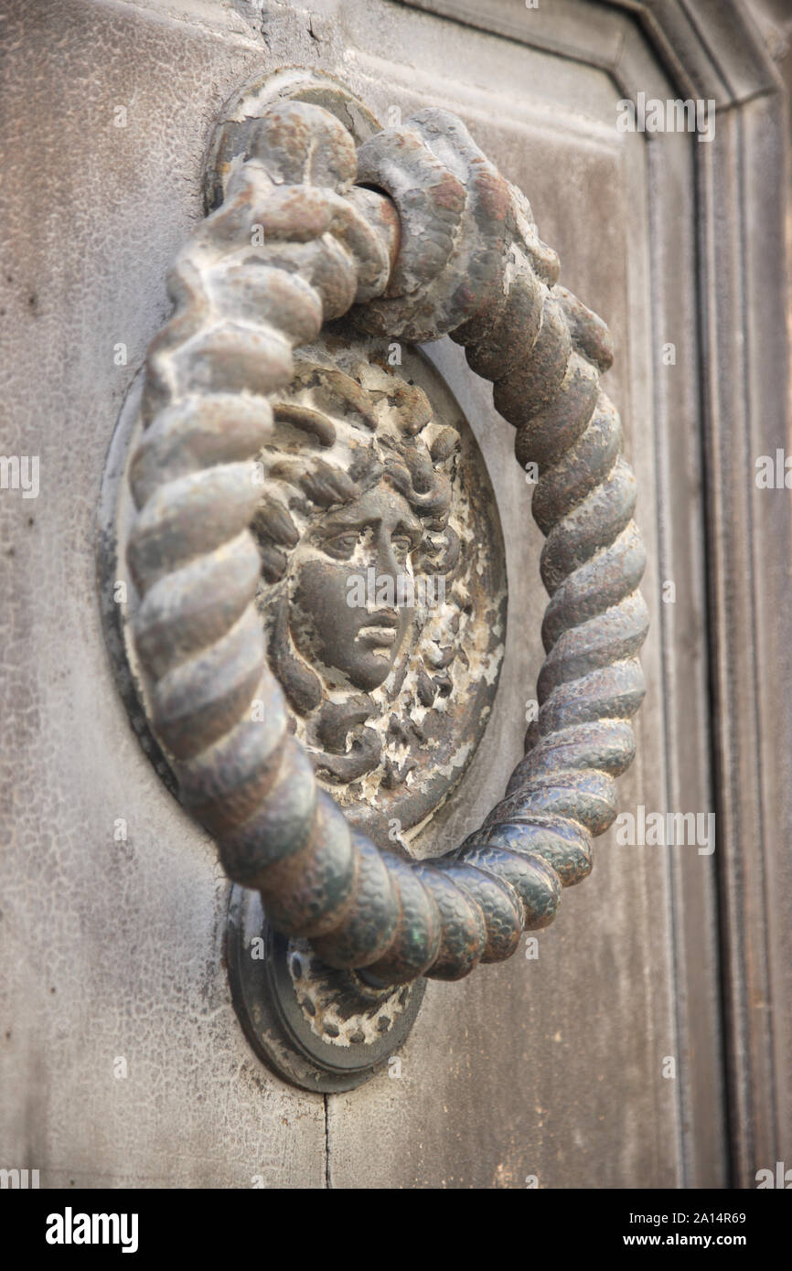 The decorative element of the handle of a massive metal gate in the ...