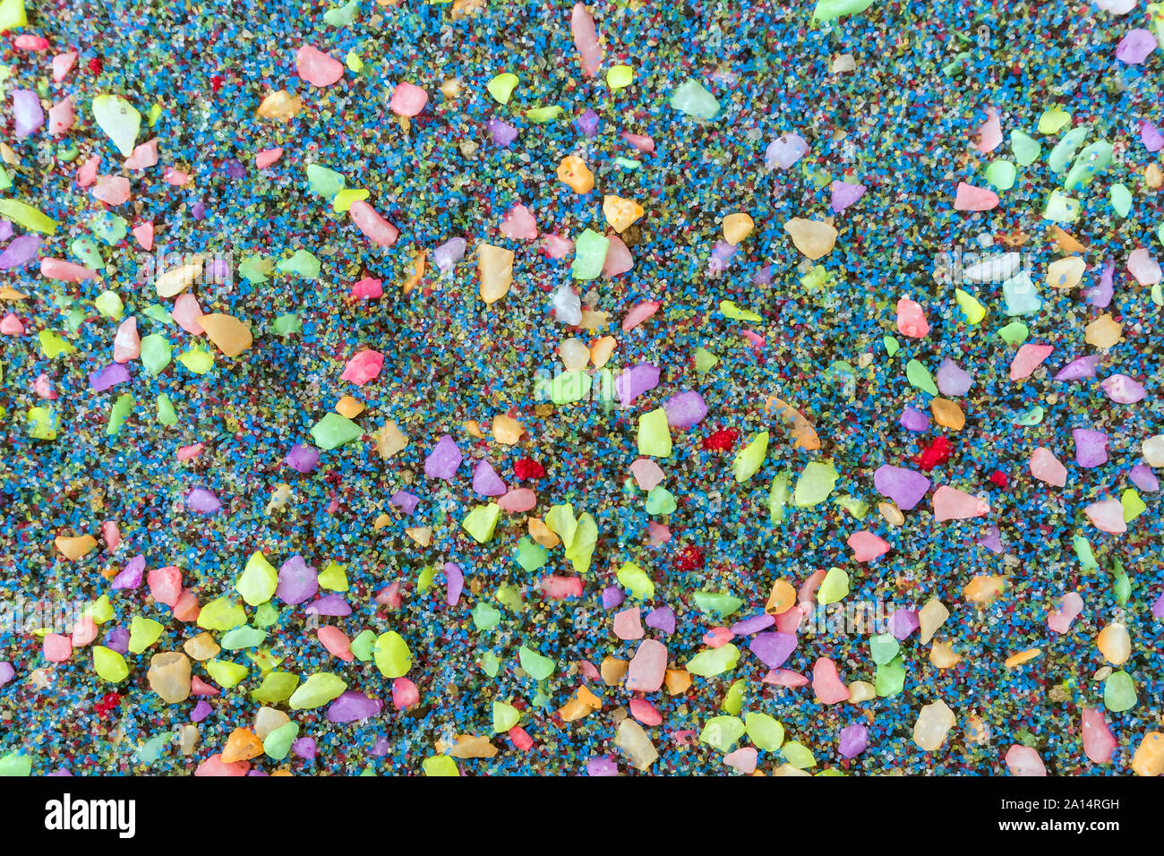 Top view with background of multi-colored small pebbles. Multi-colored ...