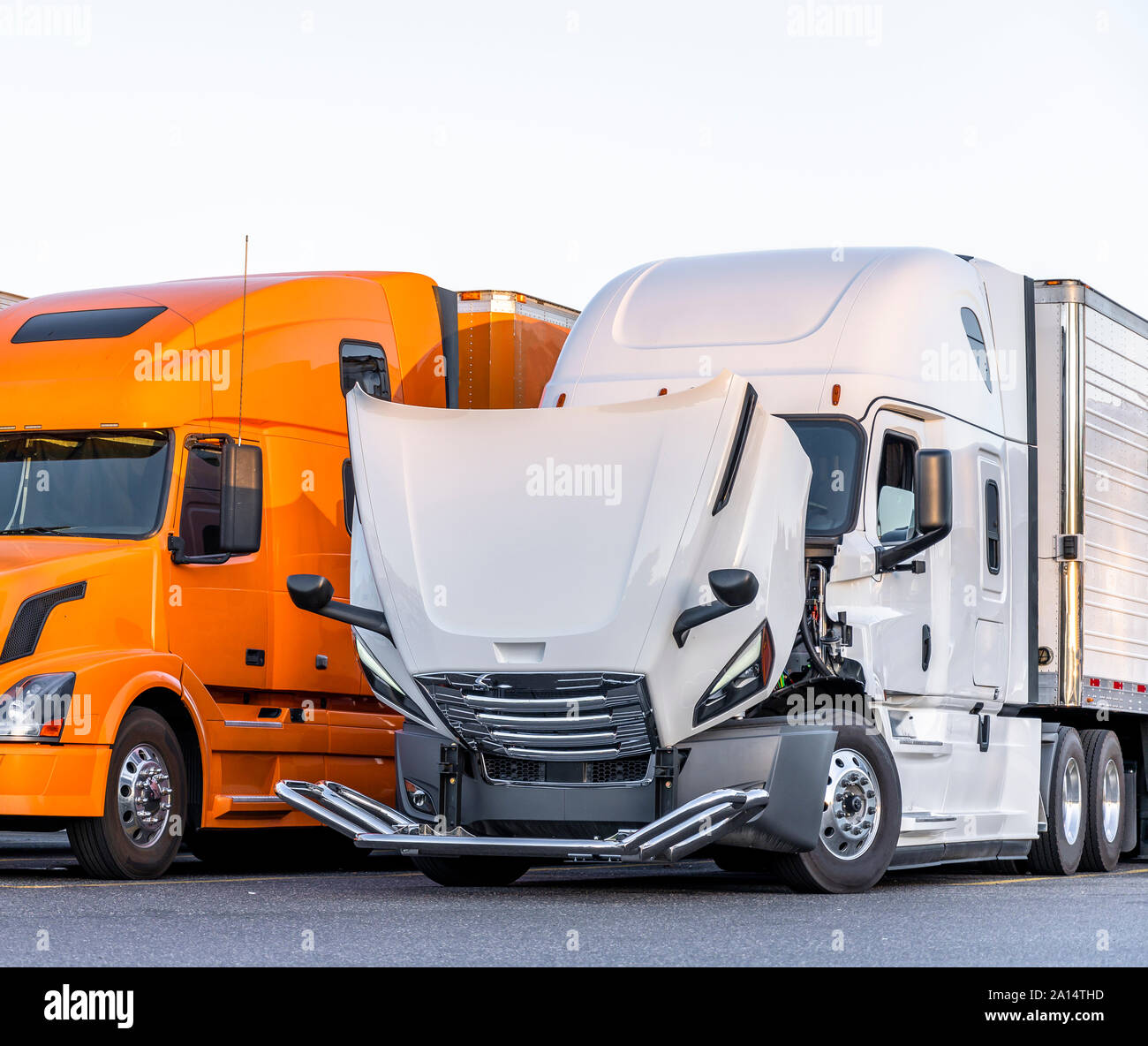 White bonnet big rig semi truck with open hood for engine inspection ...