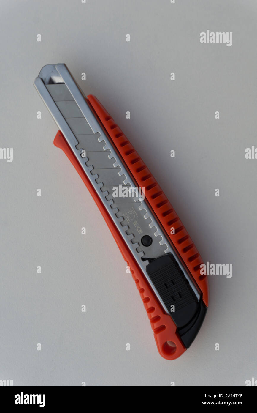 A red cutter isolated on white background Stock Photo - Alamy