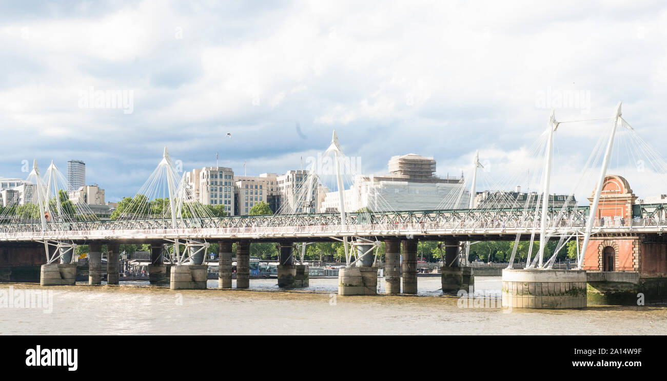 Golden Jubilee Bridges at Charing Cross Station crossing. The ...