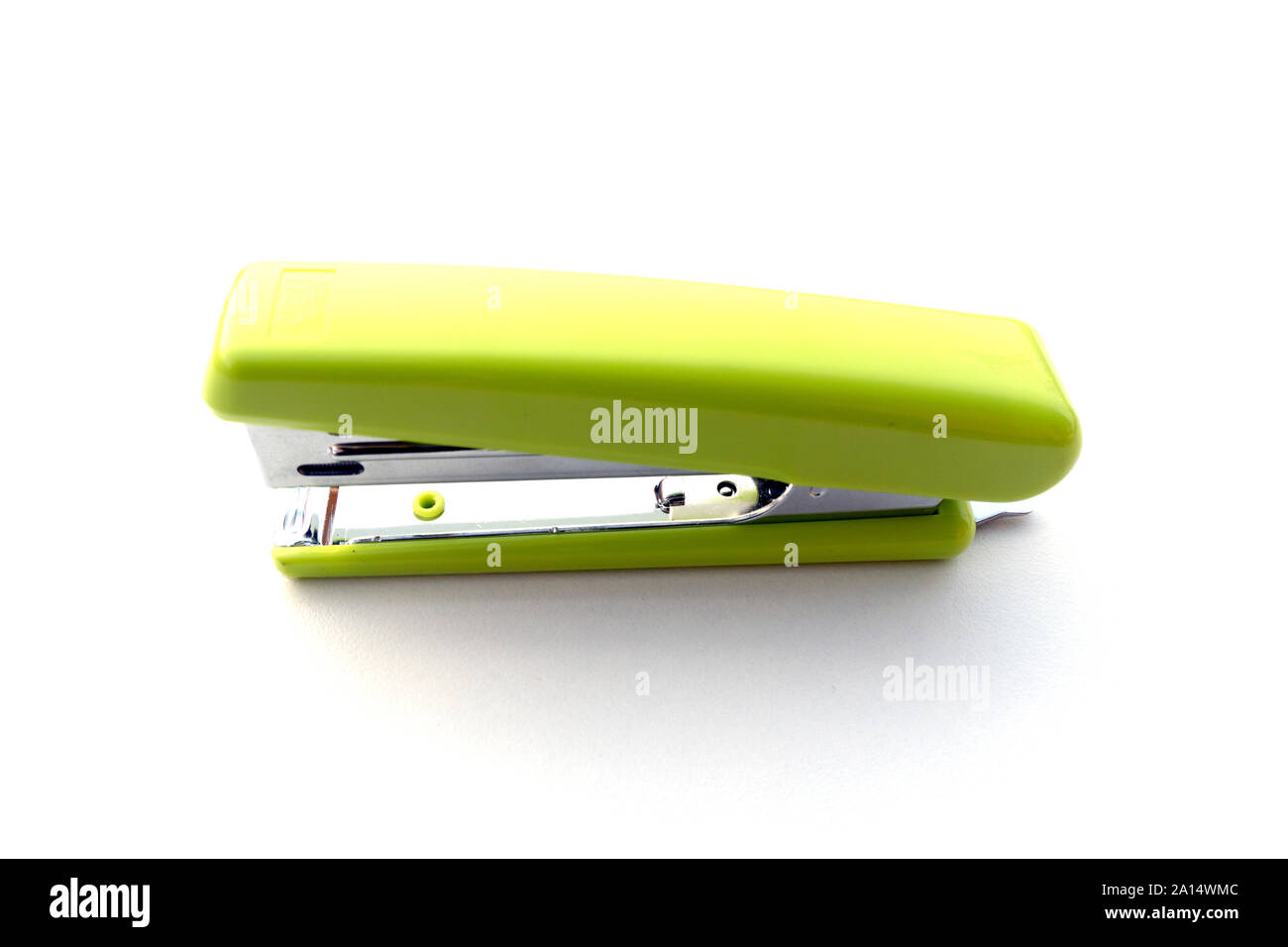 Green stapler isolated on white background Stock Photo - Alamy