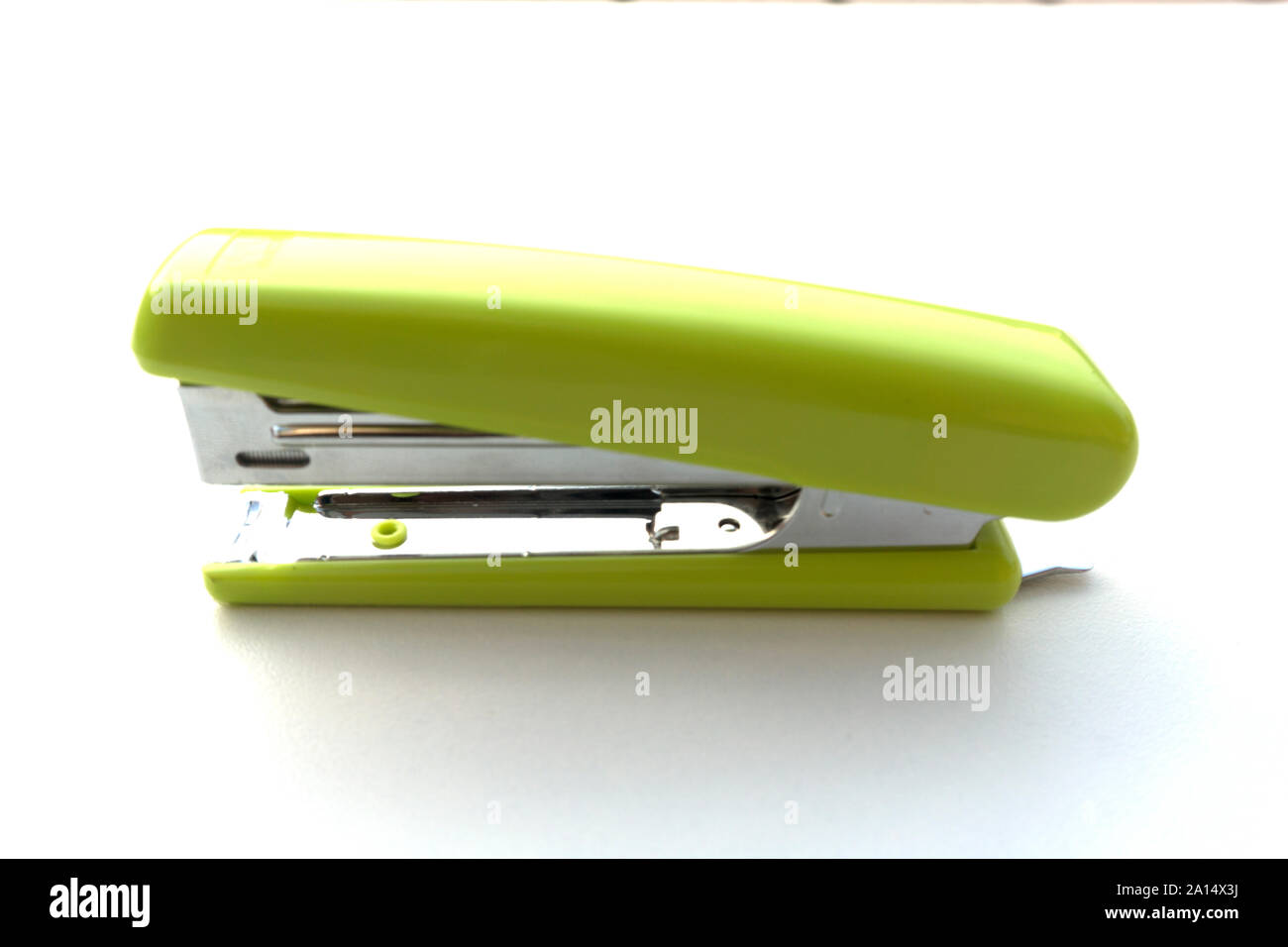 Green stapler isolated on white background Stock Photo - Alamy
